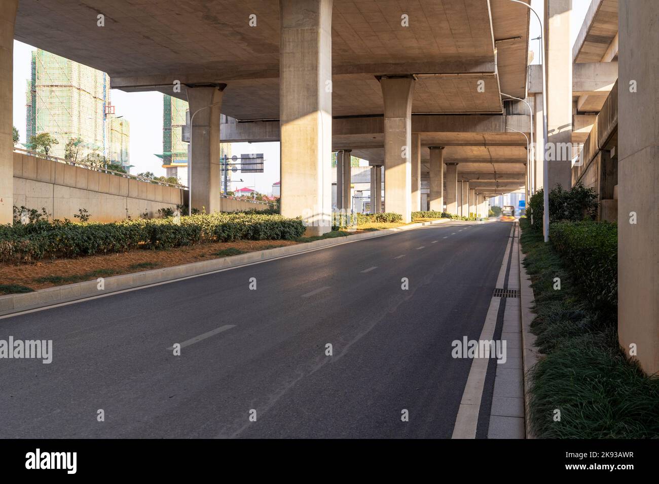 Concrete structure and asphalt road space under the overpass in the ...