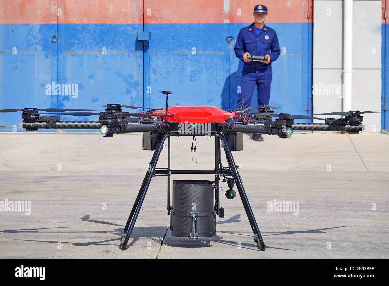 YANTAI, CHINA - OCTOBER 18, 2022 - A firefighter tests a firefighting ...