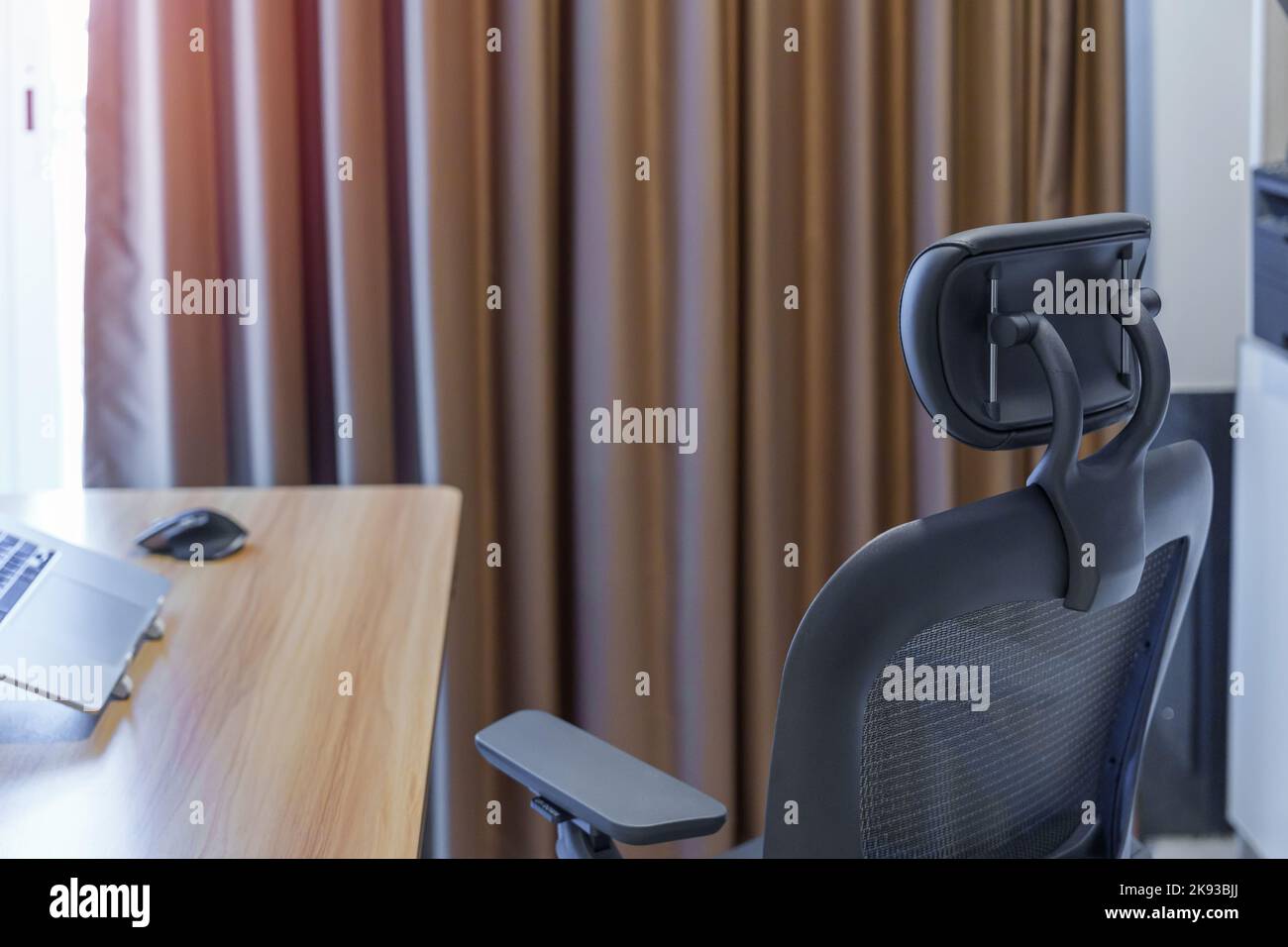 Ergonomic chair and Adjustable table with laptop computer in modern ...