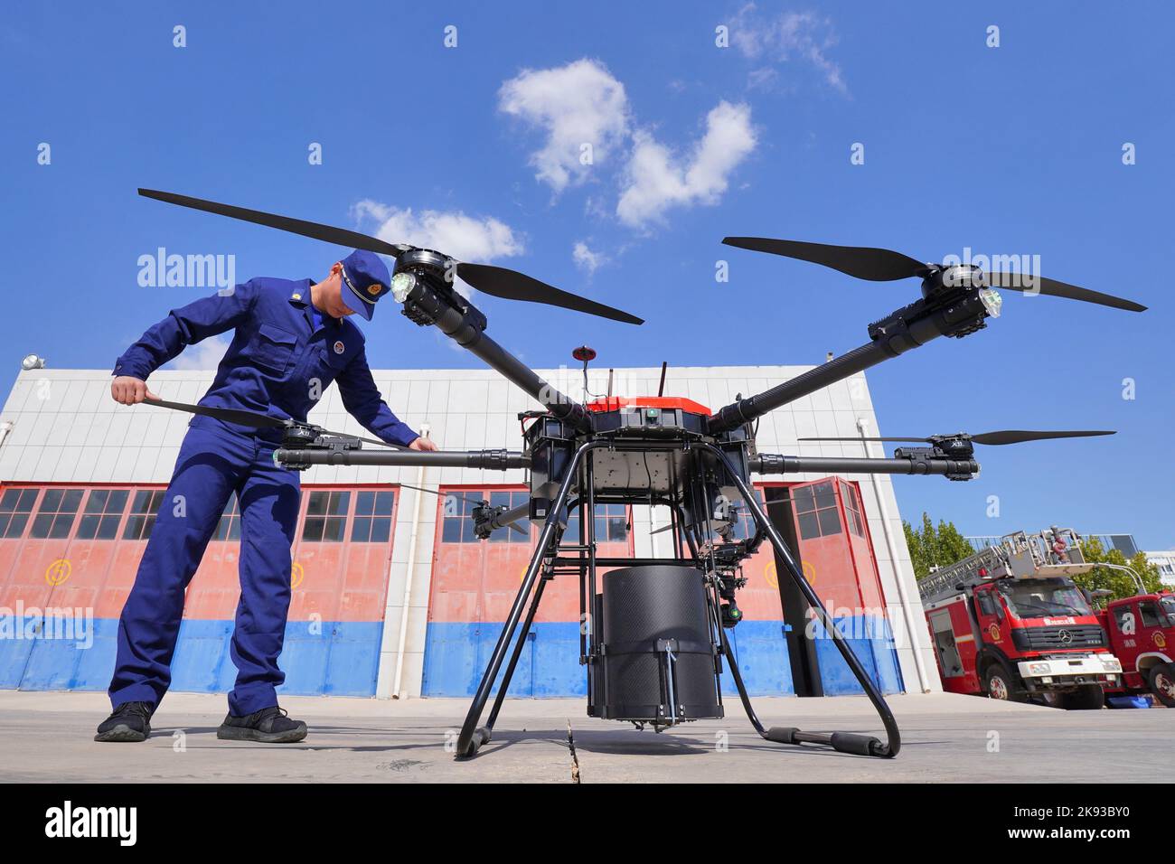 YANTAI, CHINA - OCTOBER 18, 2022 - A firefighter tests a firefighting ...