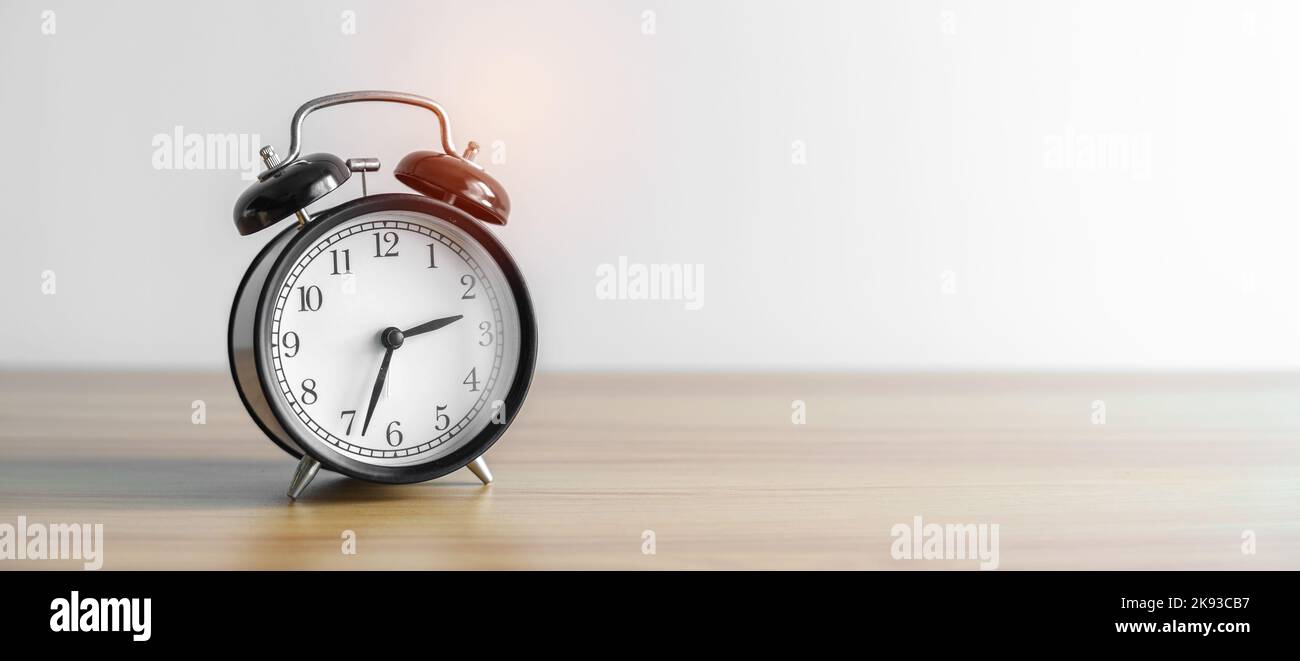 Vintage alarm clock on wooden table and copy space for text. Activity ...