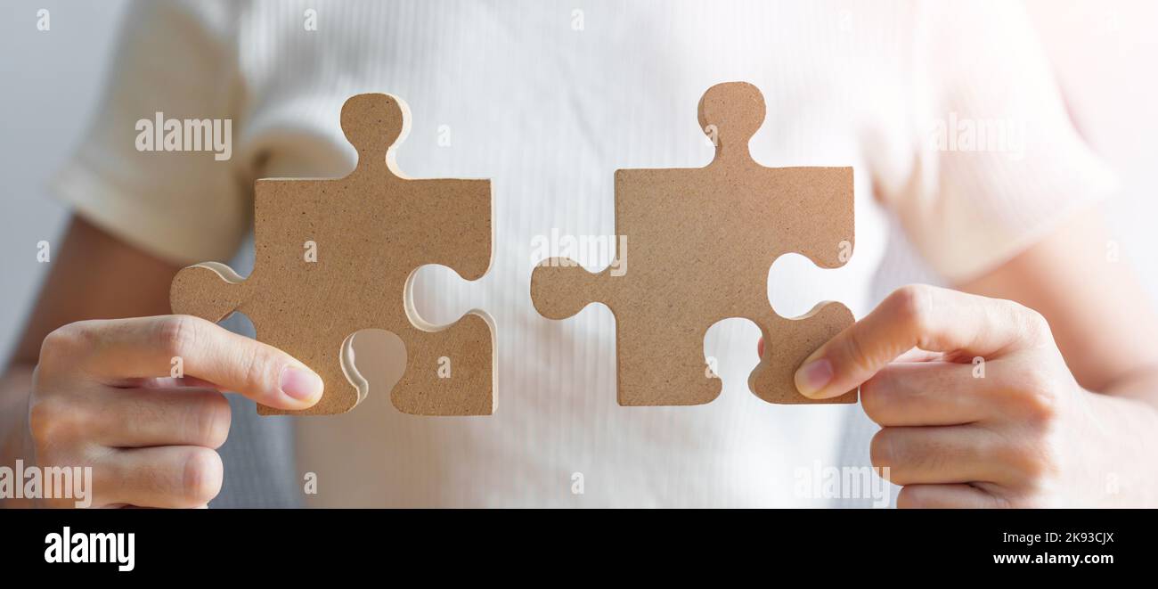 Hand connecting couple puzzle piece. Business Solving, mission ...