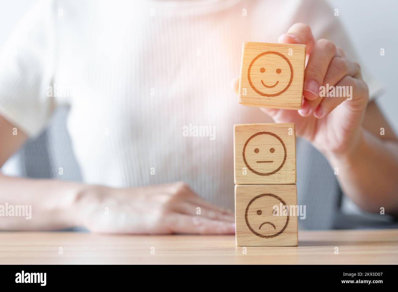 Hand choosing smile face from Emotion block. customer review, good ...