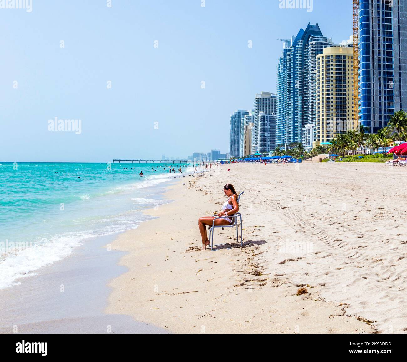 SUNNY ISLES BEACH, USA - AUG 17, 2014: woman enjoys the Jade beach ...