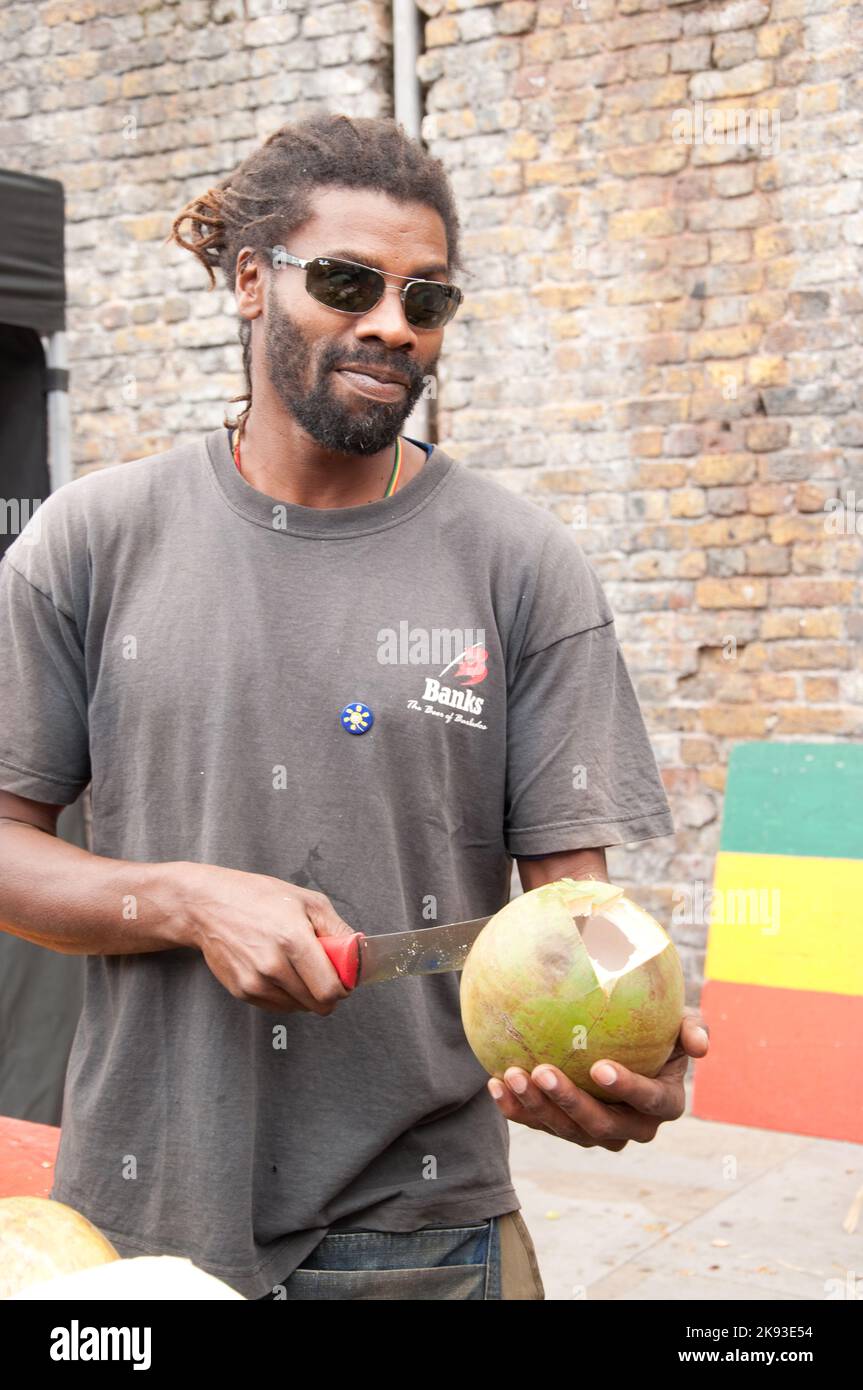 Preparing coconut drinks, Coconut King Stall, Brick Lane Market, Brick ...