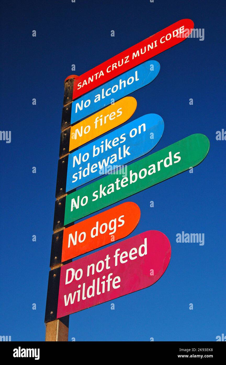 A colorful sign reminds visitors of the rules, regulations and ...