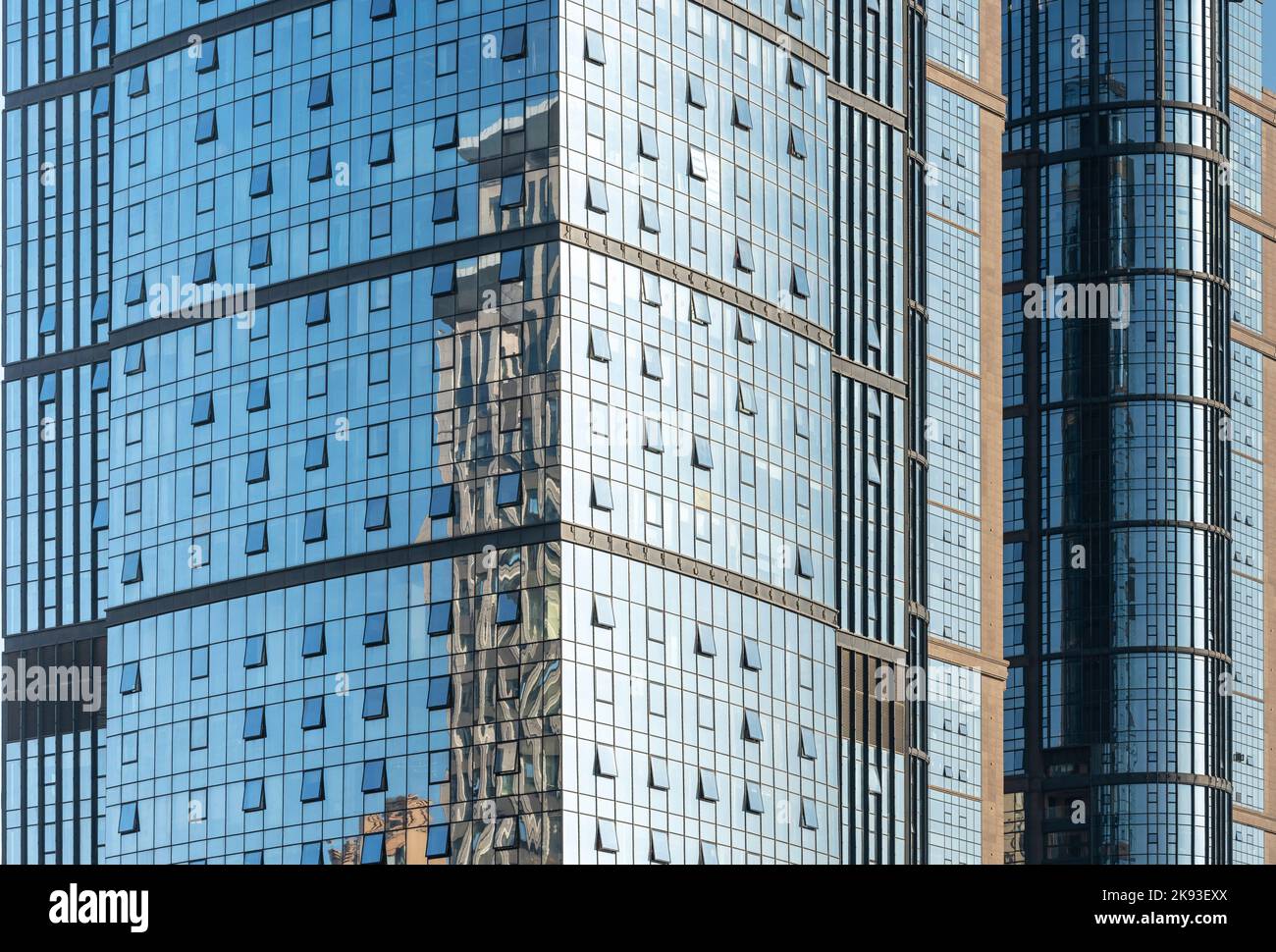 A beautiful background of an glass office building, reflecting clouds ...