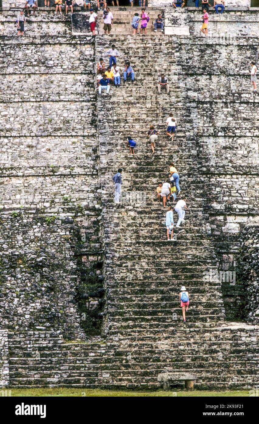 PALENQUE, MEXICO - JUNE 30, 1988: People at mayan ruins with Palace and ...