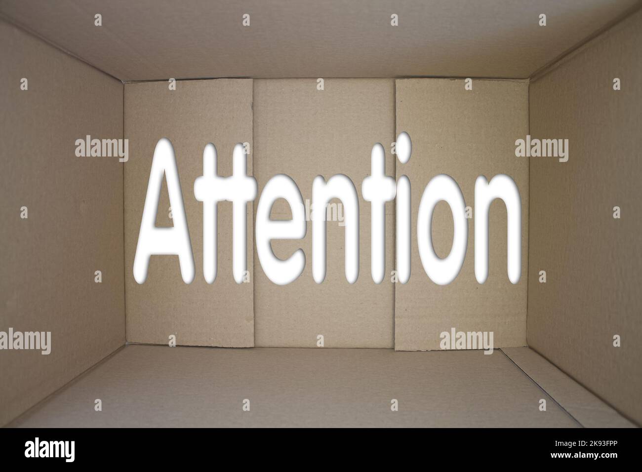 Attention word with cardboard box. Brown folded card box Stock Photo ...