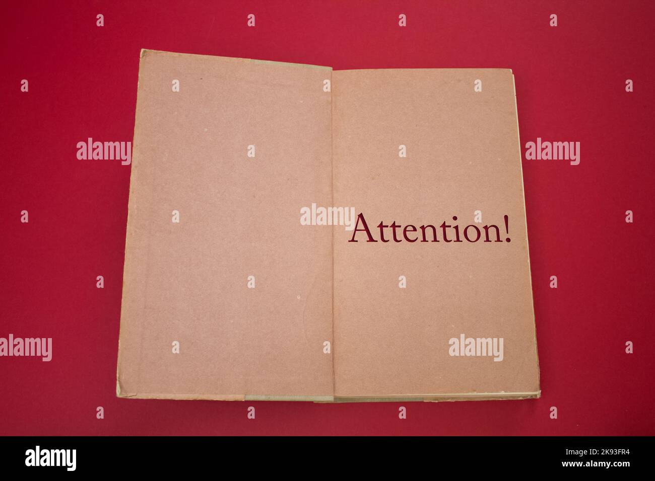 Attention word in opened book with vintage, natural patterns old ... Attention word in opened book with vintage, natural patterns old ...