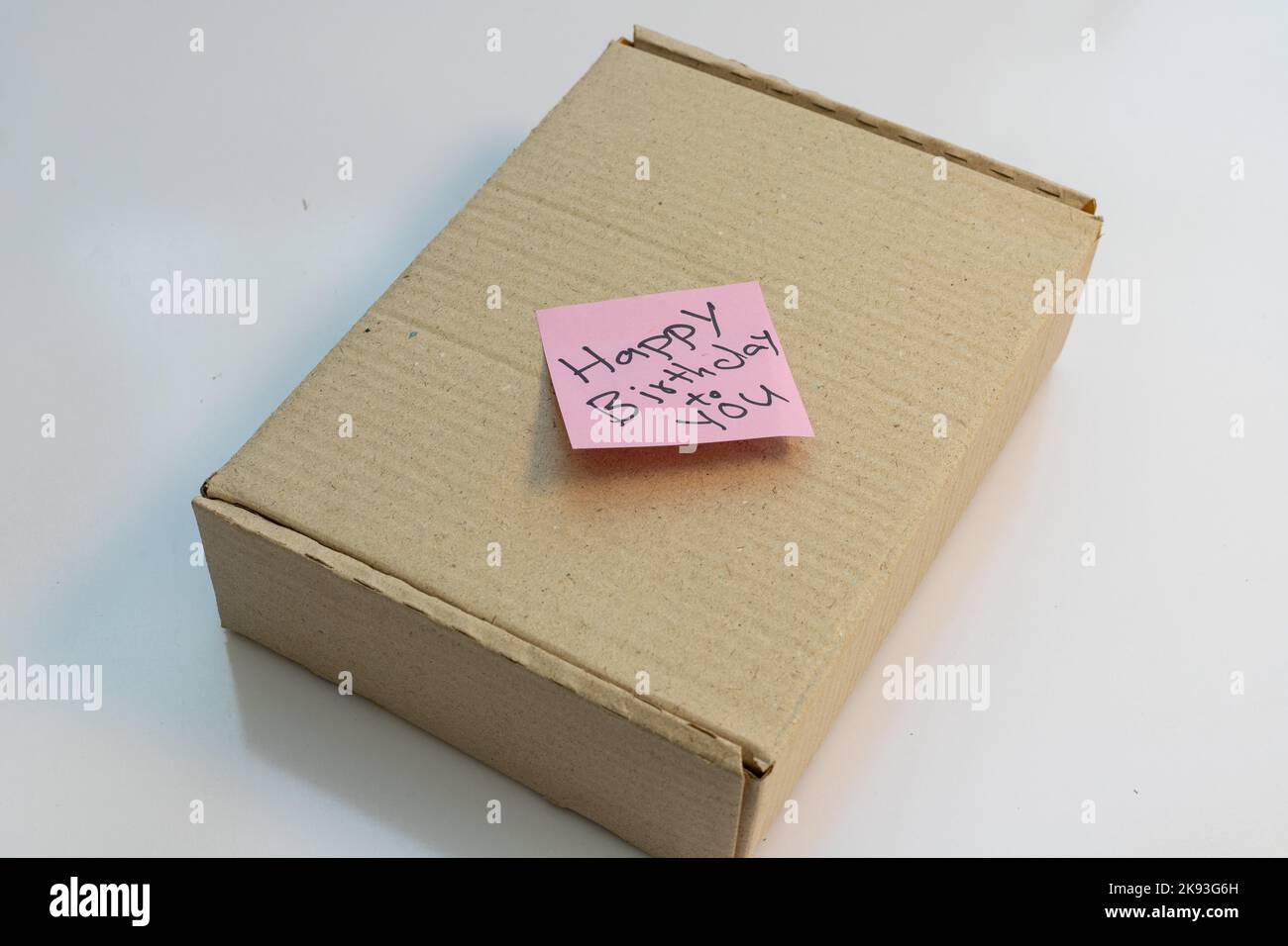 Parcel box with a text memo of Happy birthday to you written on a ...