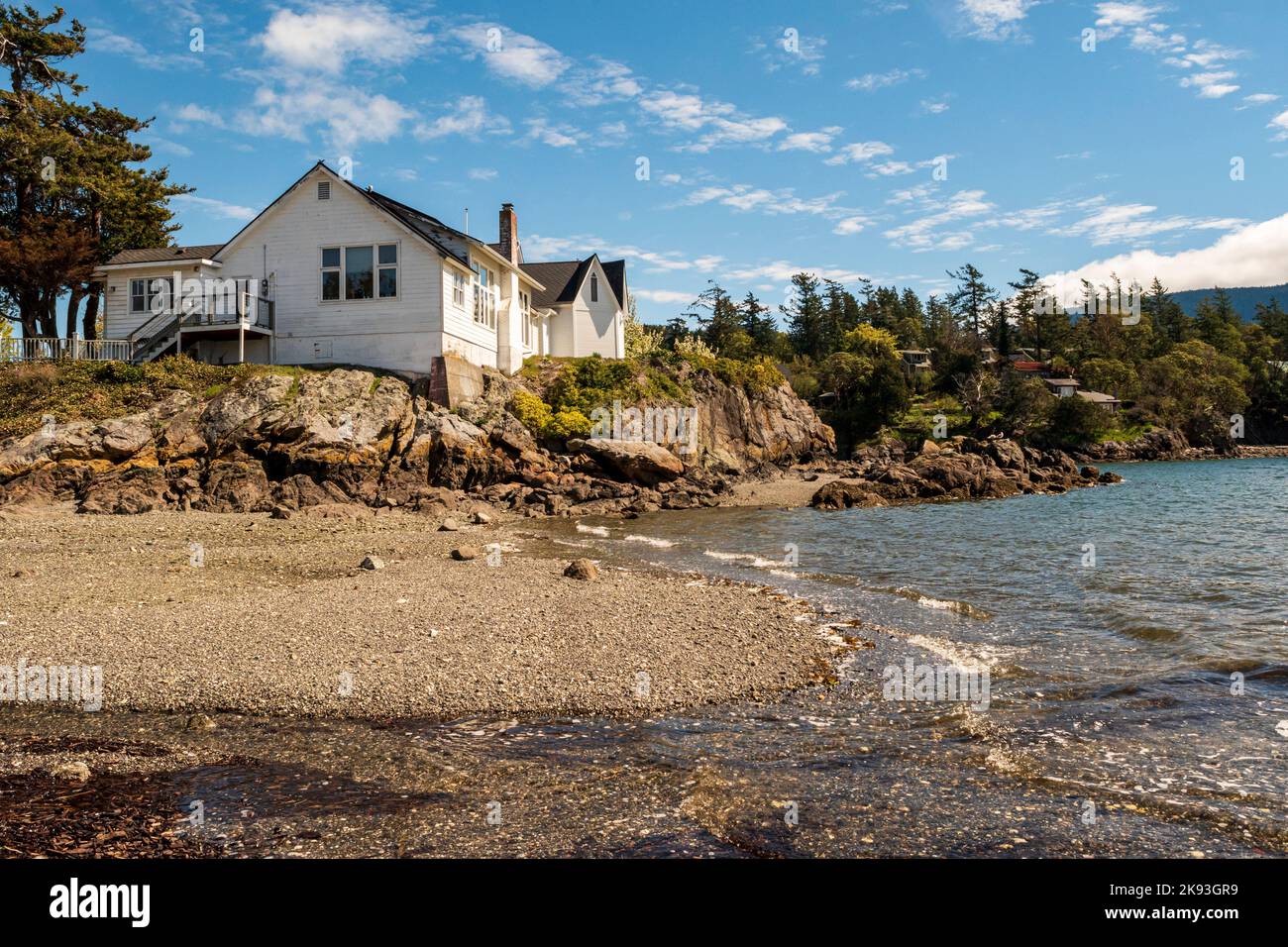 The white Emmanuel Episcopal church sits atop a seaside cliff in ...