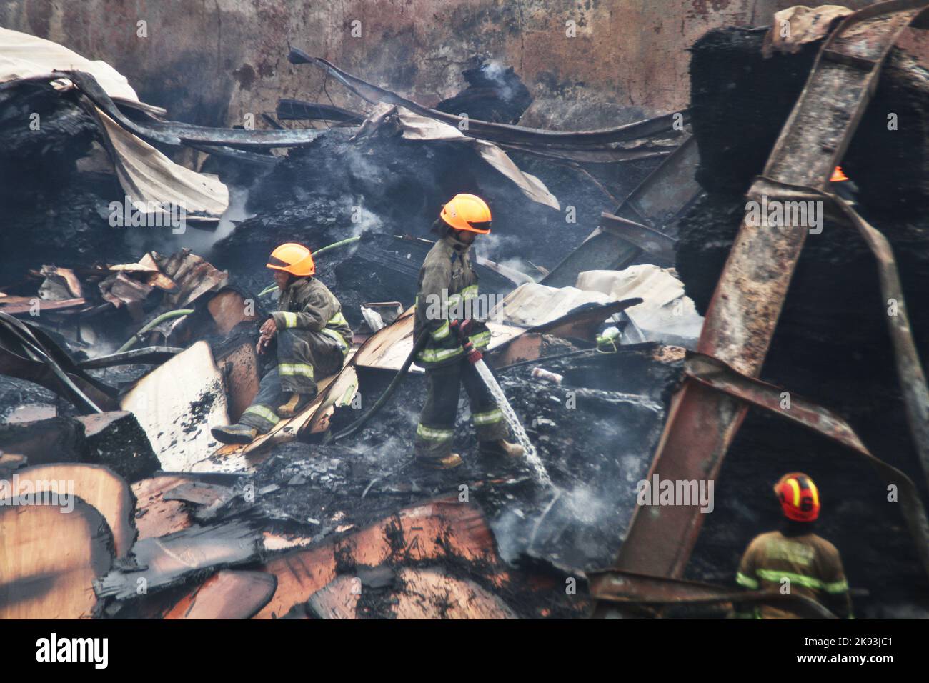 Bandung, West Java, Indonesia. 26th Oct, 2022. Firefighters attempt to extinguish a fire that ...