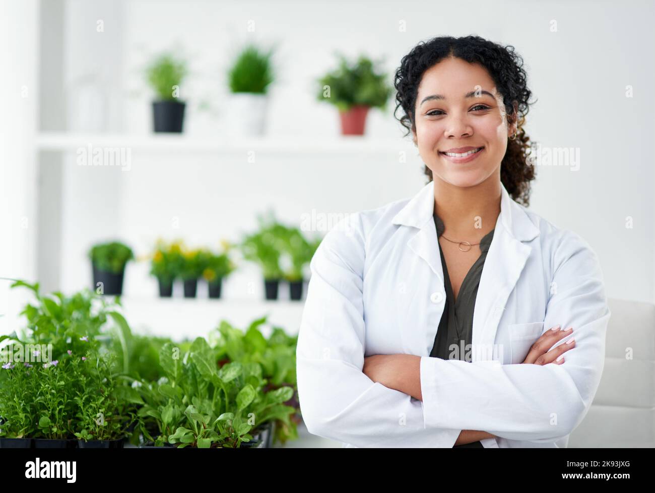 Shes an expert on the life processes of plants. Portrait of a female scientist standing in her ...