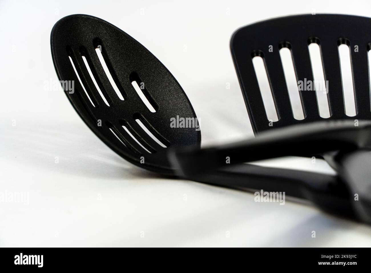spatulas and spoons black plastic on white background, mexico Stock ...