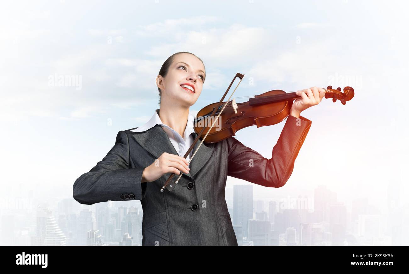 Young attractive business woman plays on skip Stock Photo - Alamy