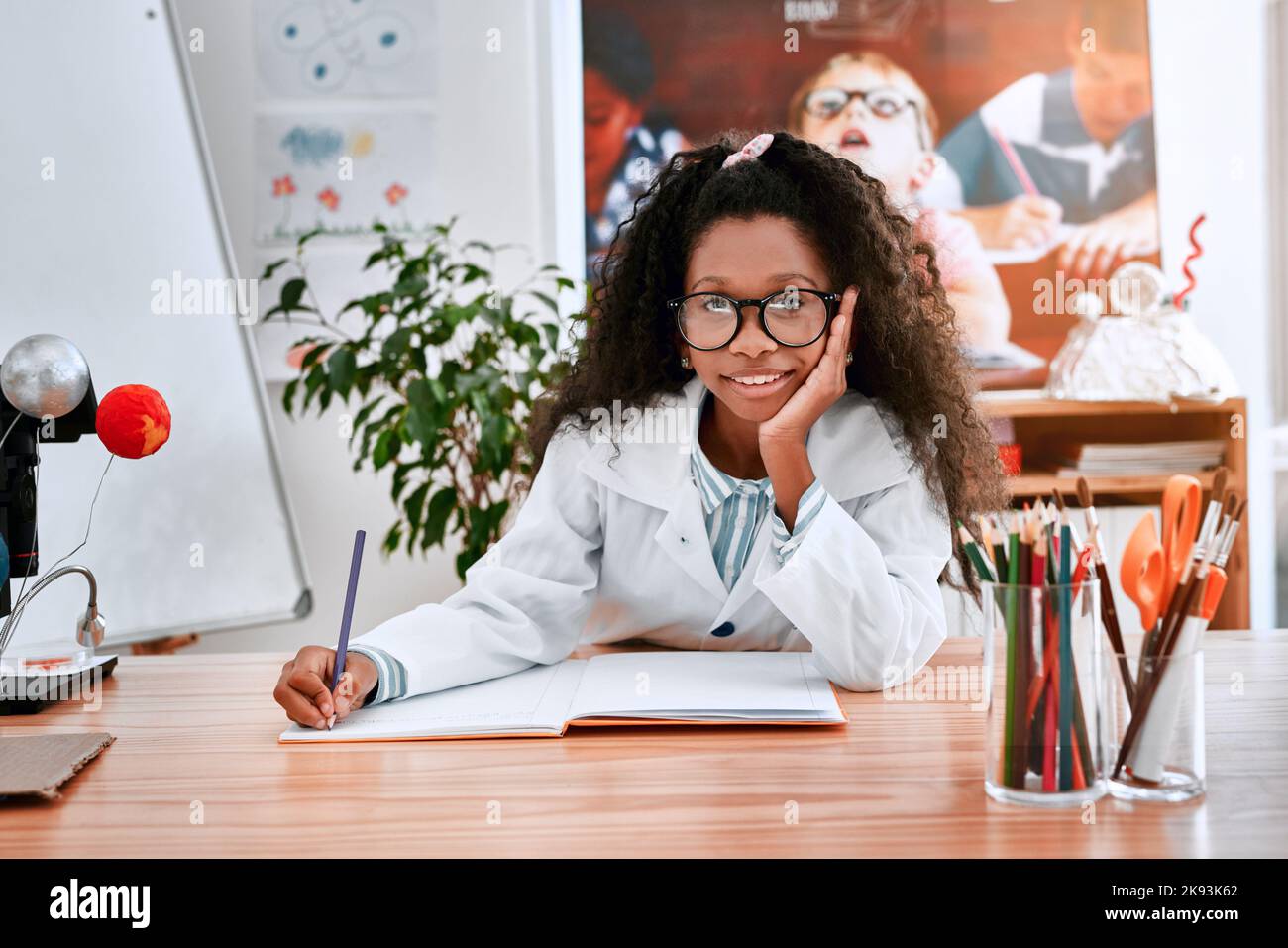 Smart is the new cool kids. Portrait of an adorable young school girl ...