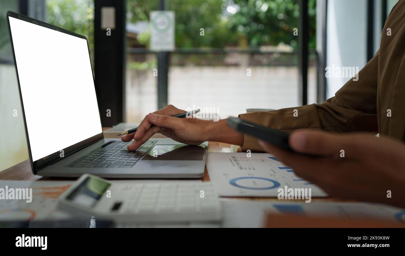 Asian businessman checking information while working with satisfaction ...