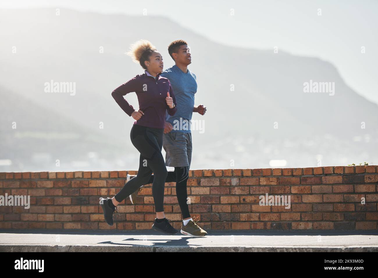 This is what we choose to do on our dates. a young couple out for a run ...