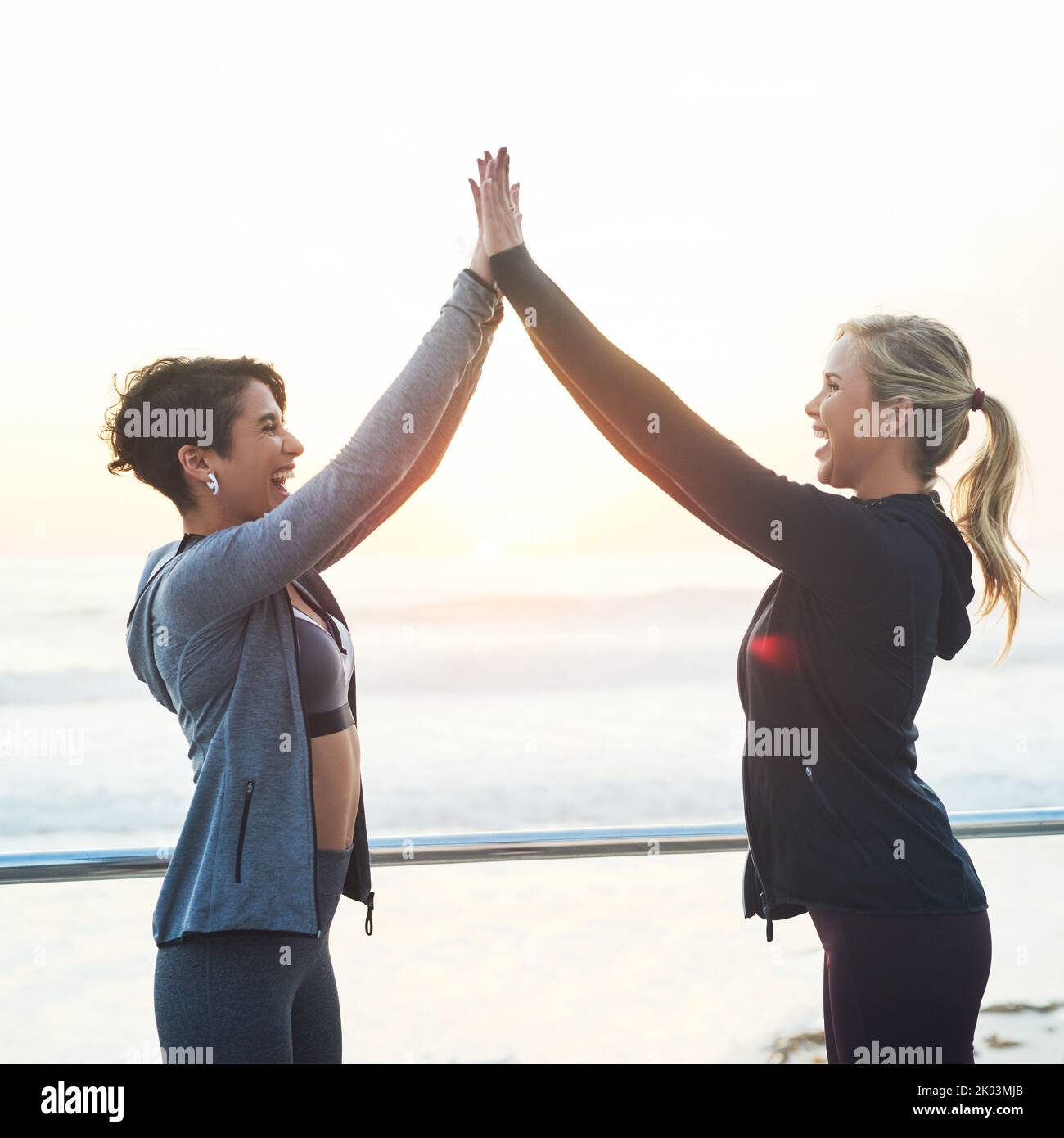 Through friendship, we can conquer it all. two young women giving each ...