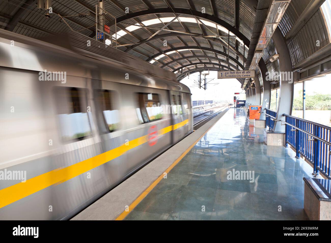 DELHI - NOVEMBER 11: passengers in metro station with arriving train on ...