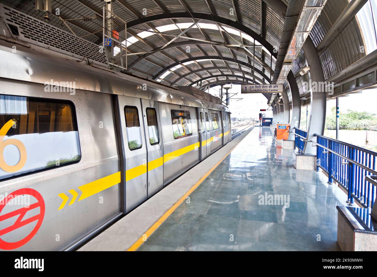 DELHI - NOVEMBER 11: passengers in metro station with arriving train on ...