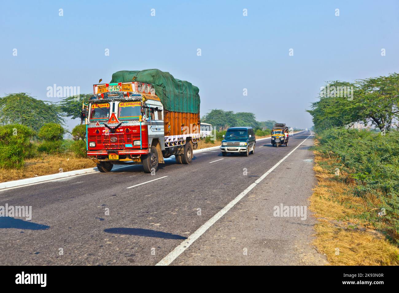 AGRA, INDIA - NOVEMBER 16: people in overloaded cars on the Highway on ...