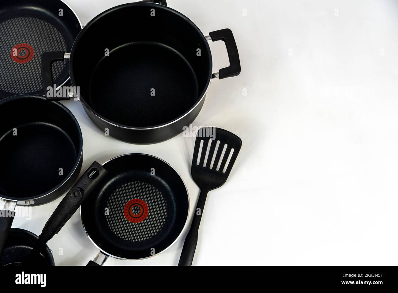 cookware set, steel dinner set isolated on white background, black ...