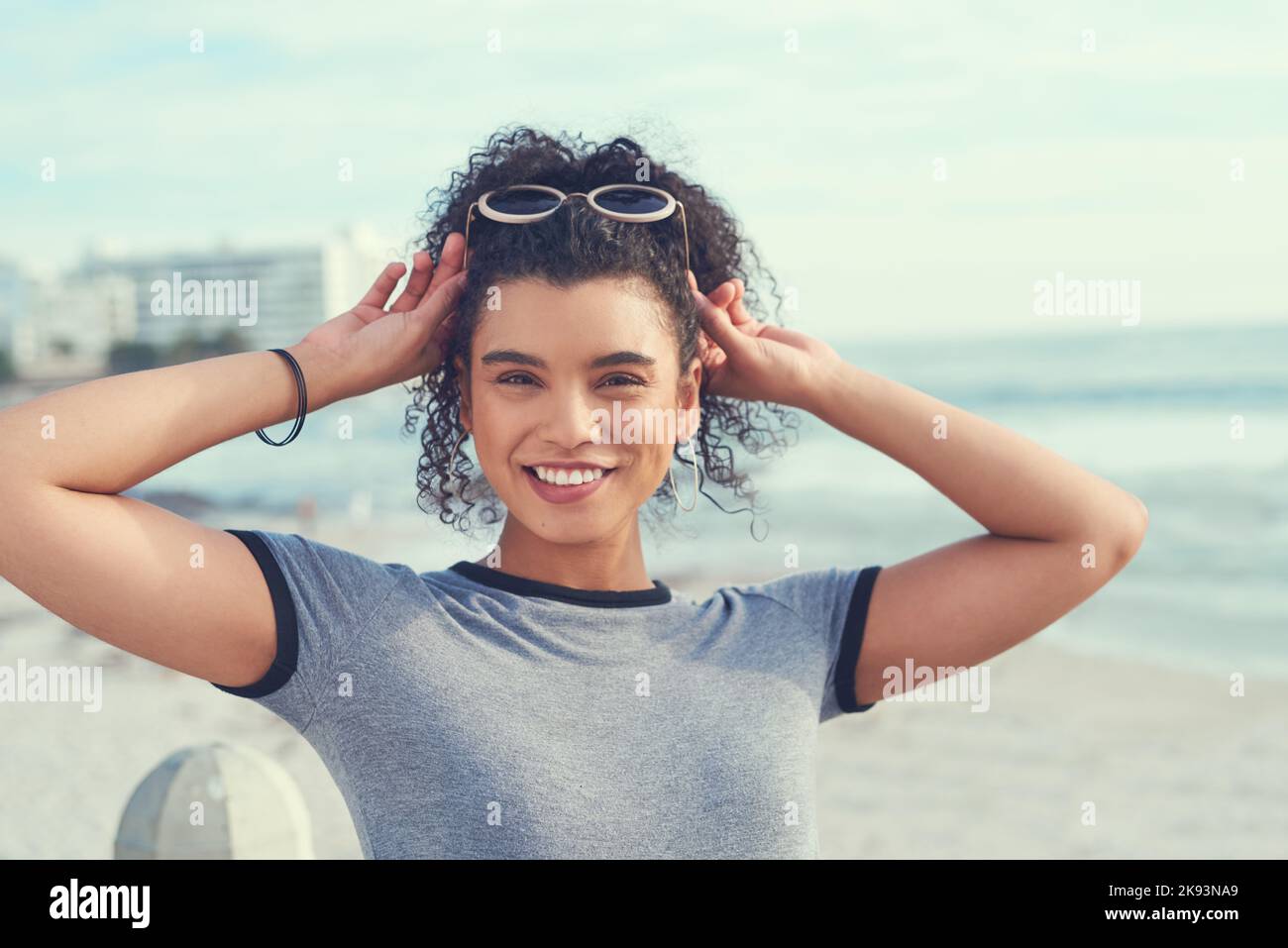Lets not be shady. a young woman spending the day on the promenade at ...