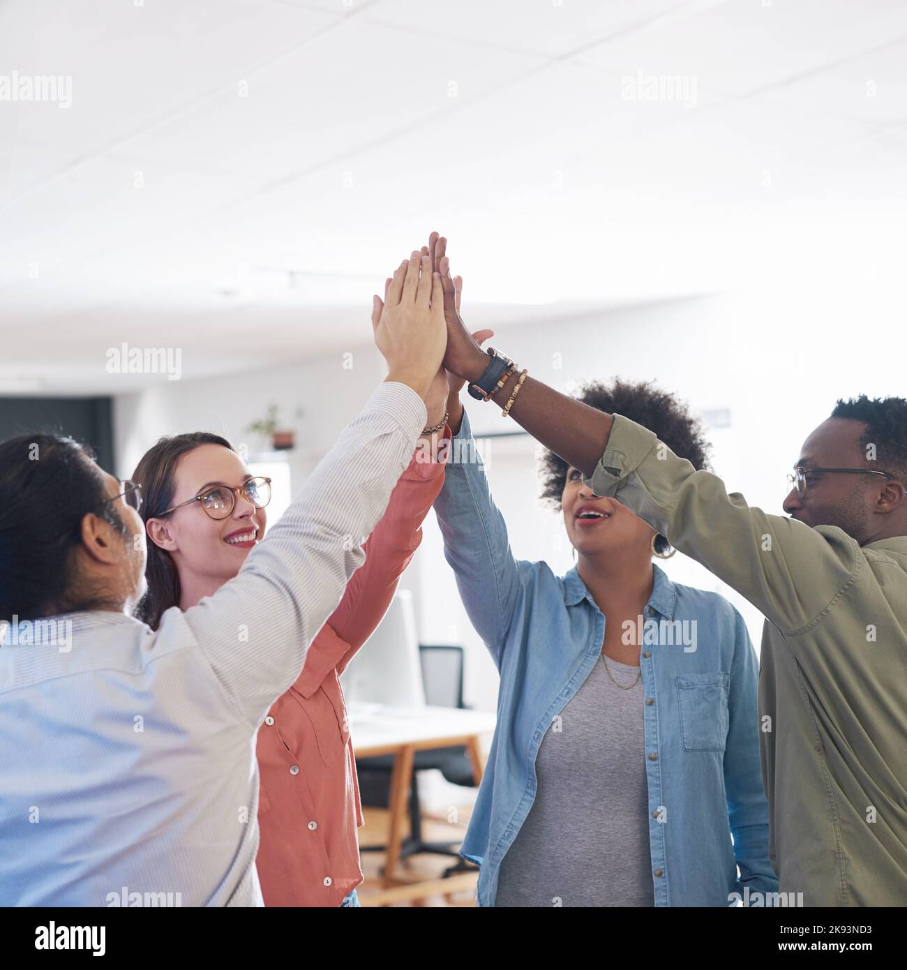 Young multiracial people joining hands hi-res stock photography and ...