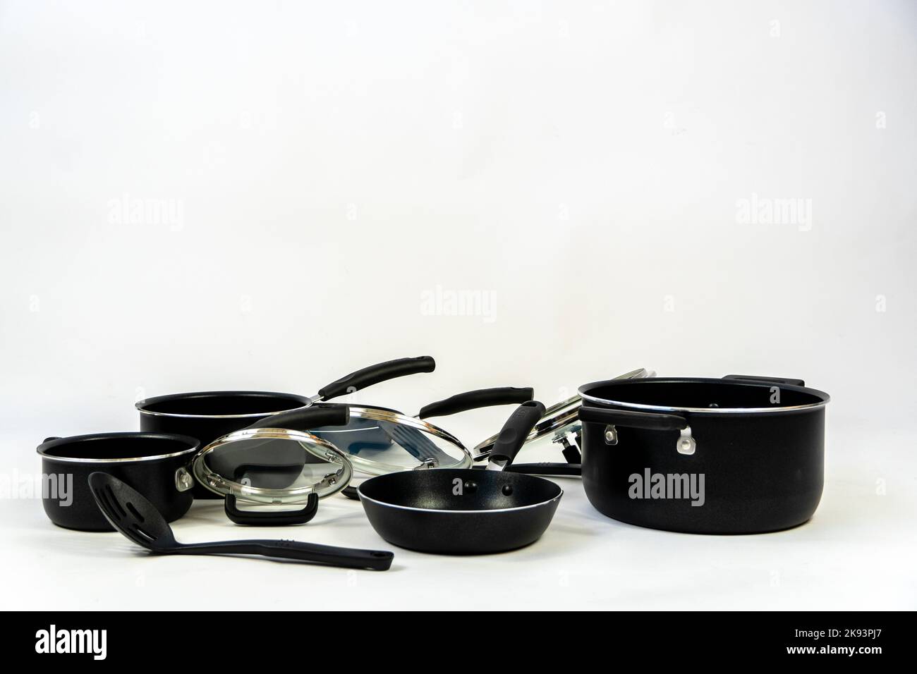 cookware set, steel dinner set isolated on white background, black ...