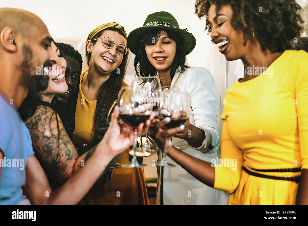 Cheerful group of multiethnic best friends celebrating aperitif ...