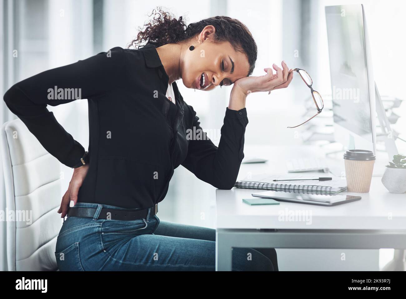 Woman back ache office desk hi-res stock photography and images - Alamy