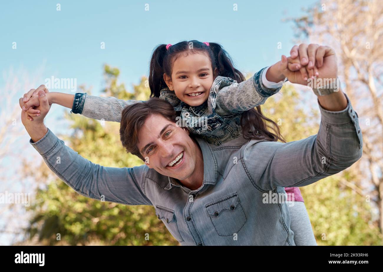 Every child loves a good old piggyback ride. an adorable little girl ...