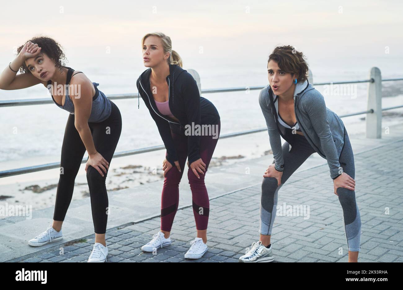 That was a good run. three young women looking tired after their run ...