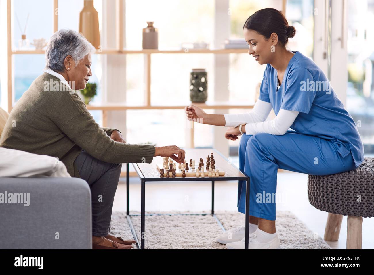 Theres always a fun element to their day. a young nurse playing chess ...