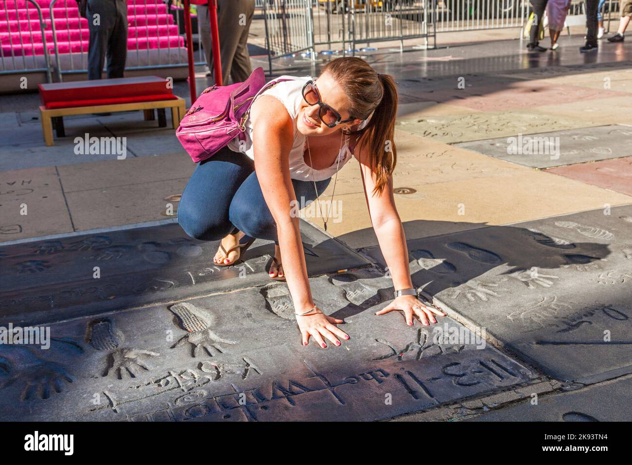 LOS ANGELES - JUNE 26: fan puts hand in handprints of twilight saga ...