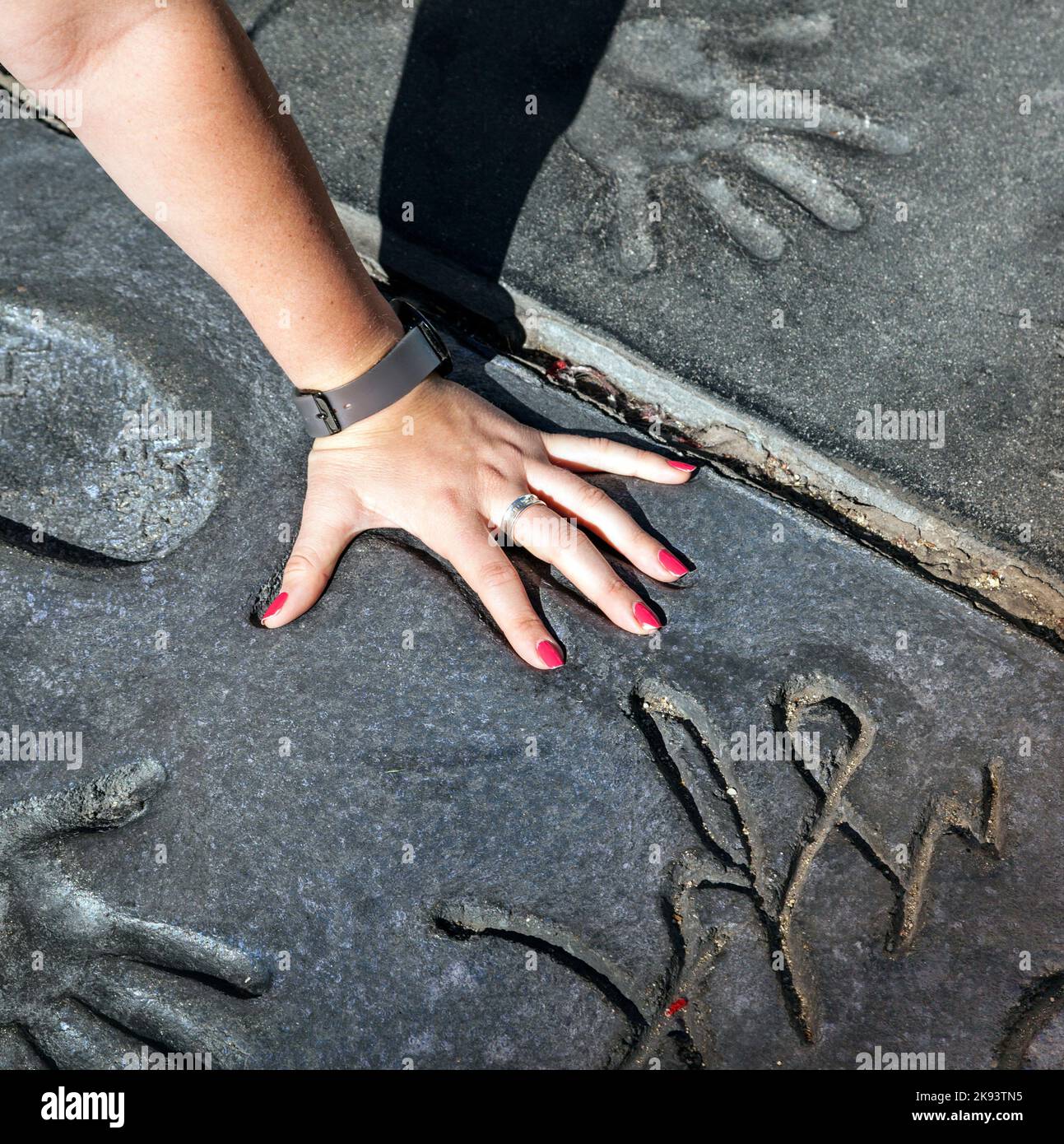 LOS ANGELES - JUNE 26: fan puts hand in handprints of twilight saga ...