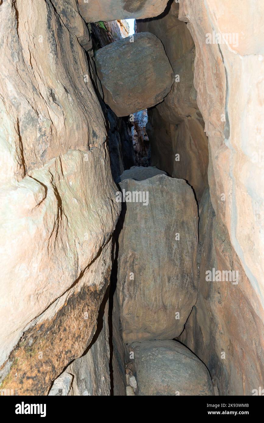 The trail in the narrow Wolfberg Crack passes through a small opening ...