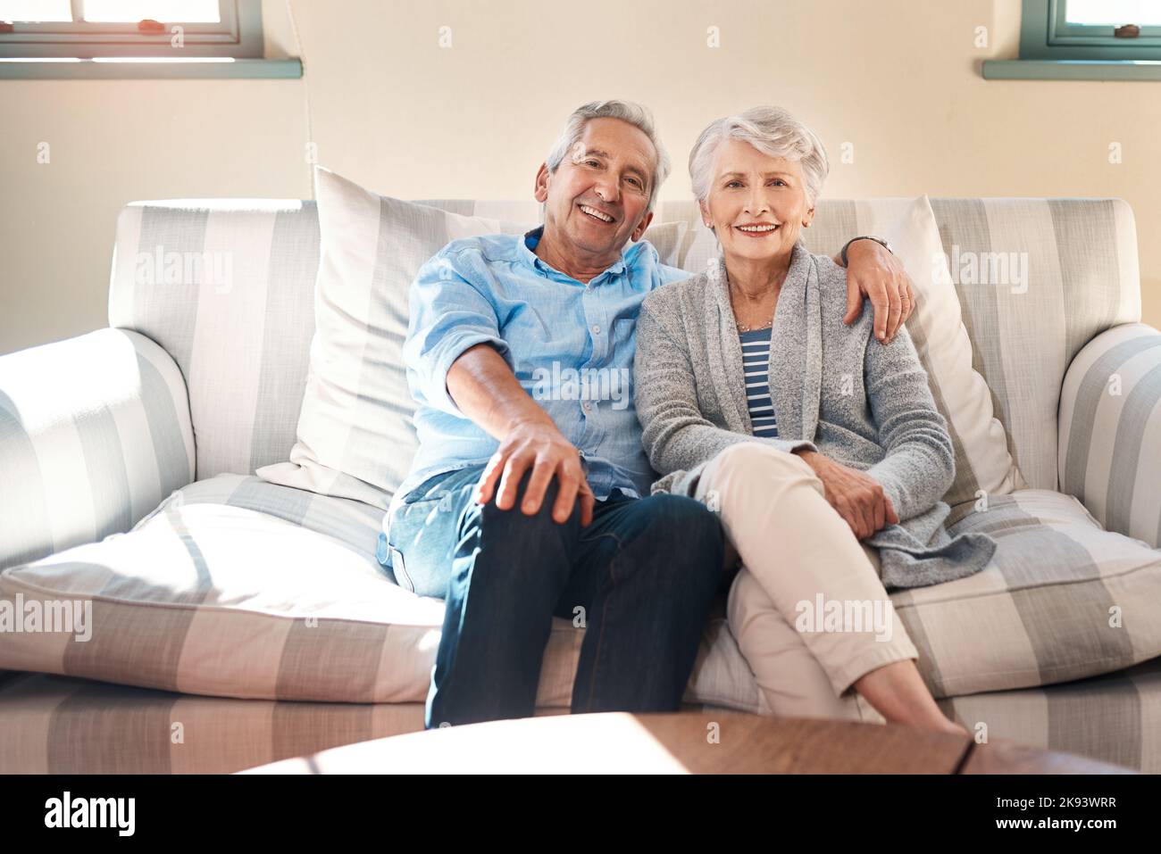 Our love is here to stay. a senior couple relaxing together on the sofa ...
