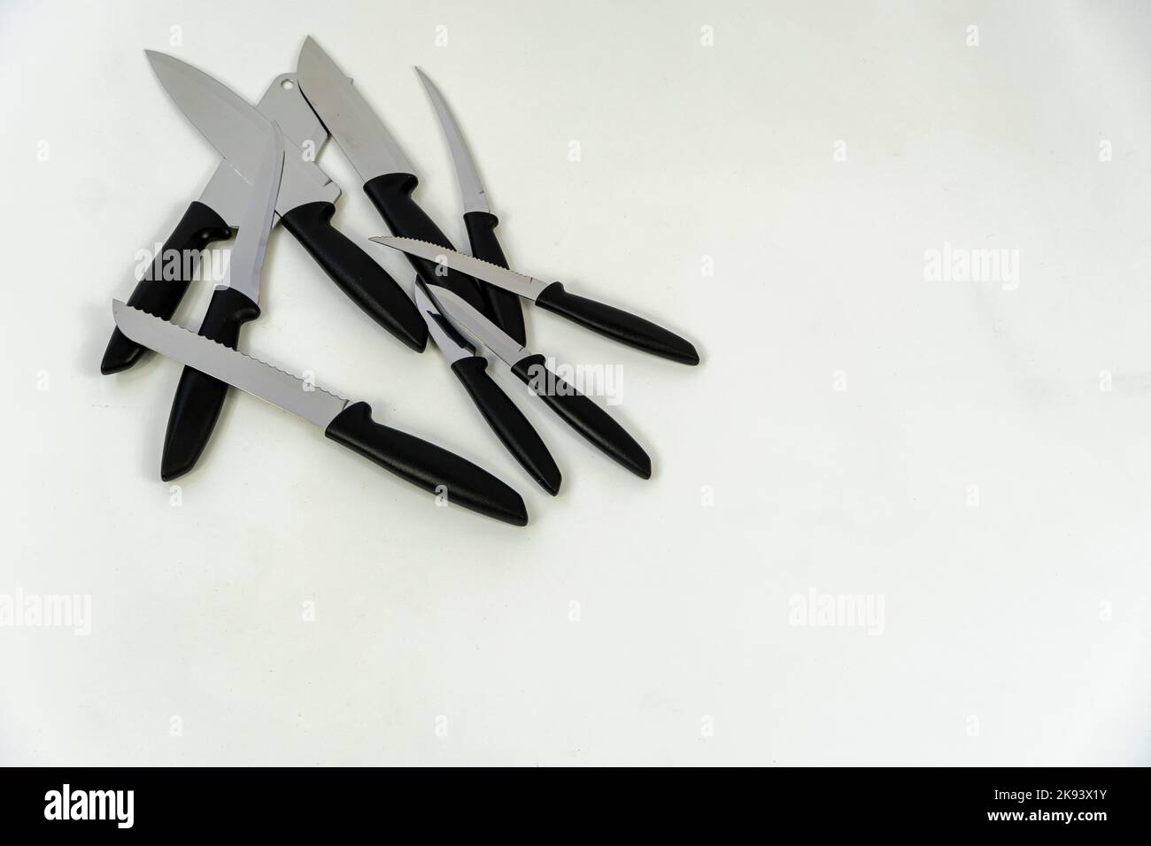 Sharp large kitchen knife on a dark surface, white background mexico ...