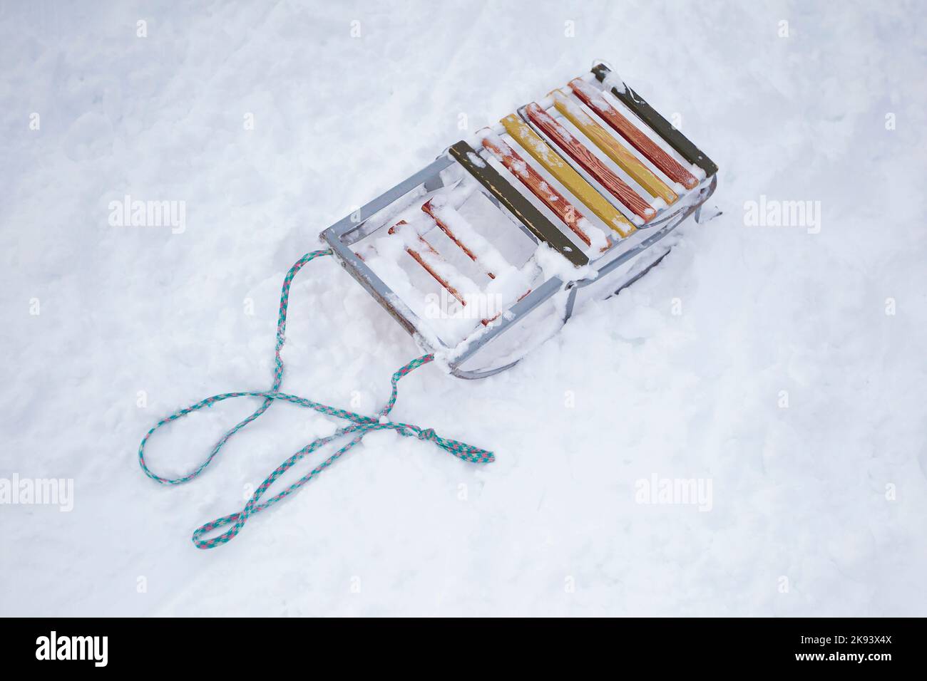Old sled with a rope on the snow top view Stock Photo - Alamy
