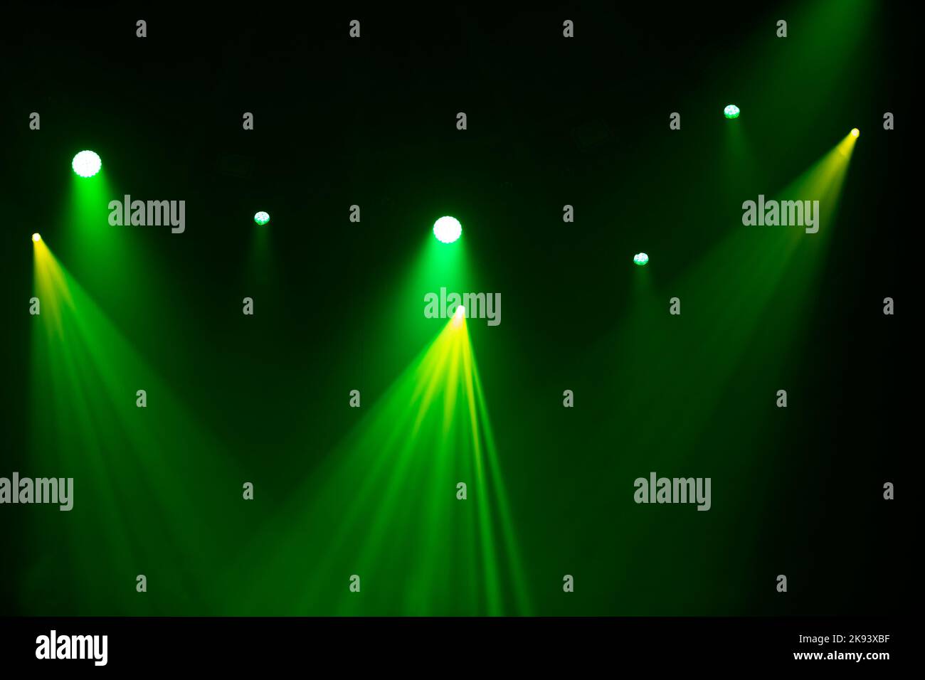 Green stage light from spotlights on a dark background Stock Photo - Alamy