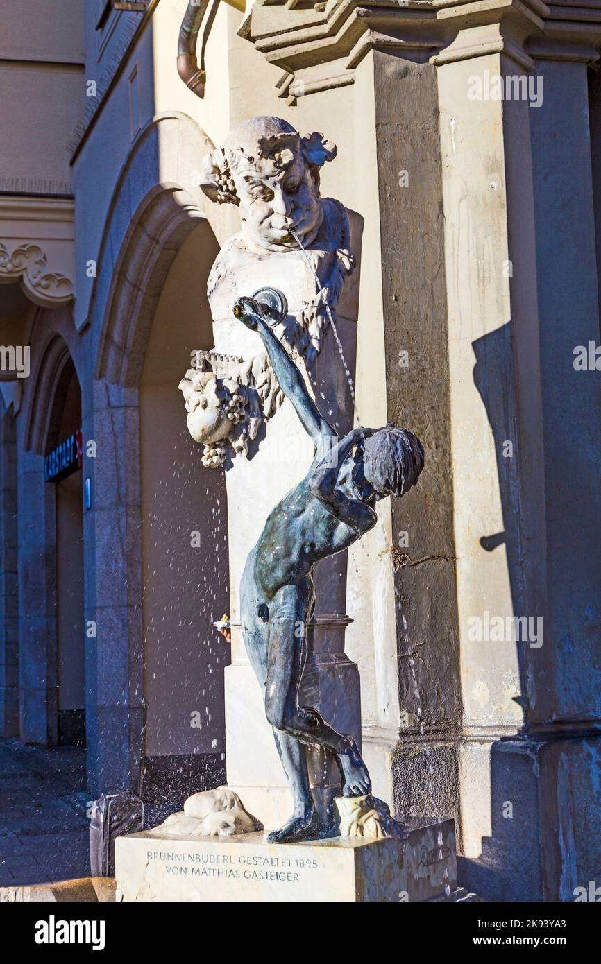 MUNICH, GERMANY - DEC 27, 2013: famous fountain Brunnenbuberl in Munich ...