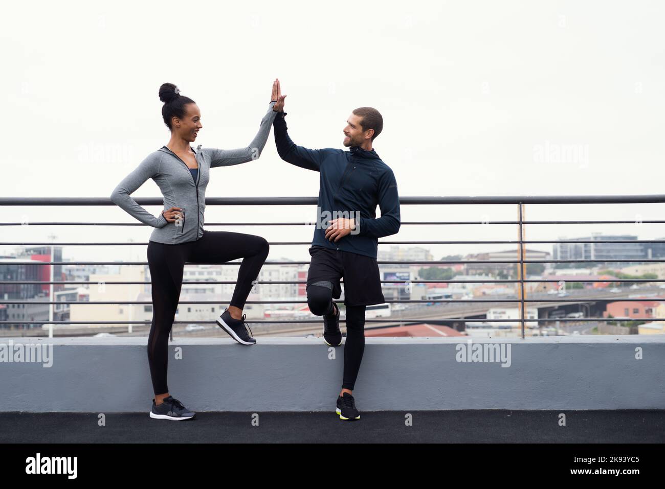 Being active together means staying happy together. a sporty young man ...