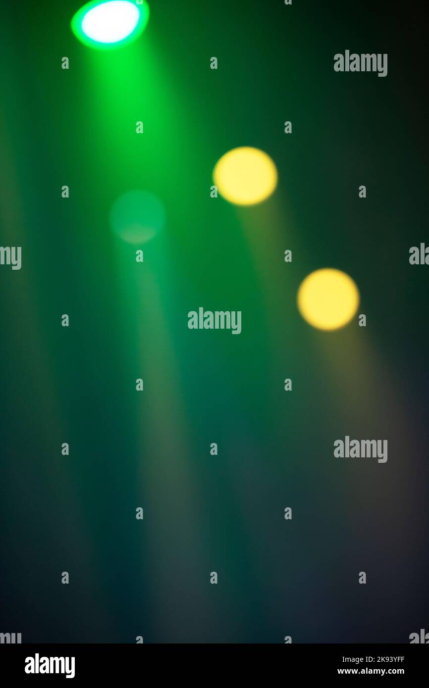 Green stage light from spotlights on a dark background Stock Photo - Alamy