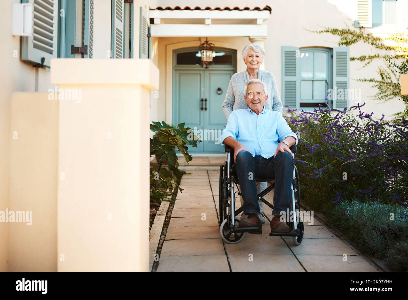 Rolling around with my love. Full length shot of a cheerful wheelchair ...