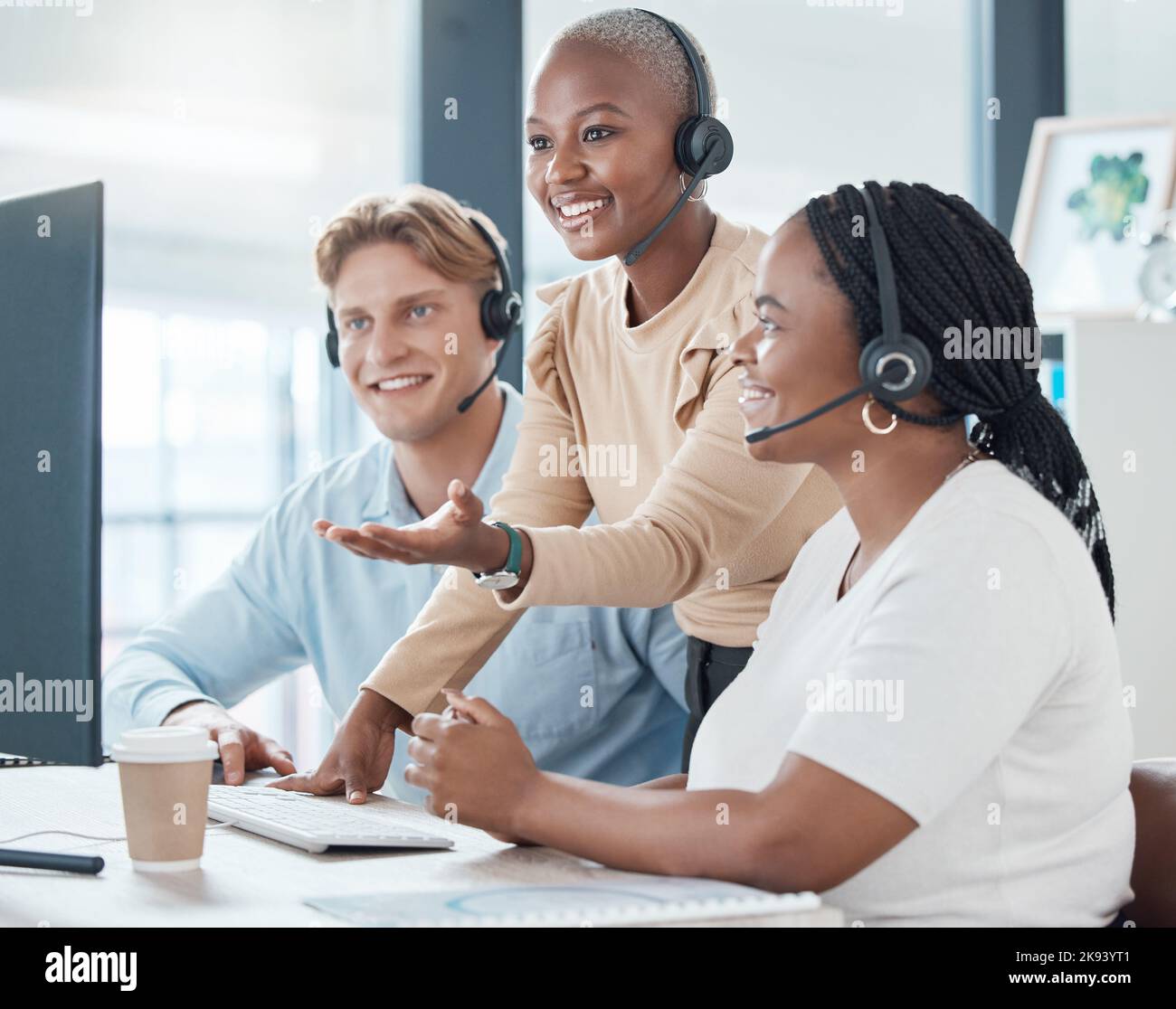 Training, teamwork and call center team in office on computer working ...