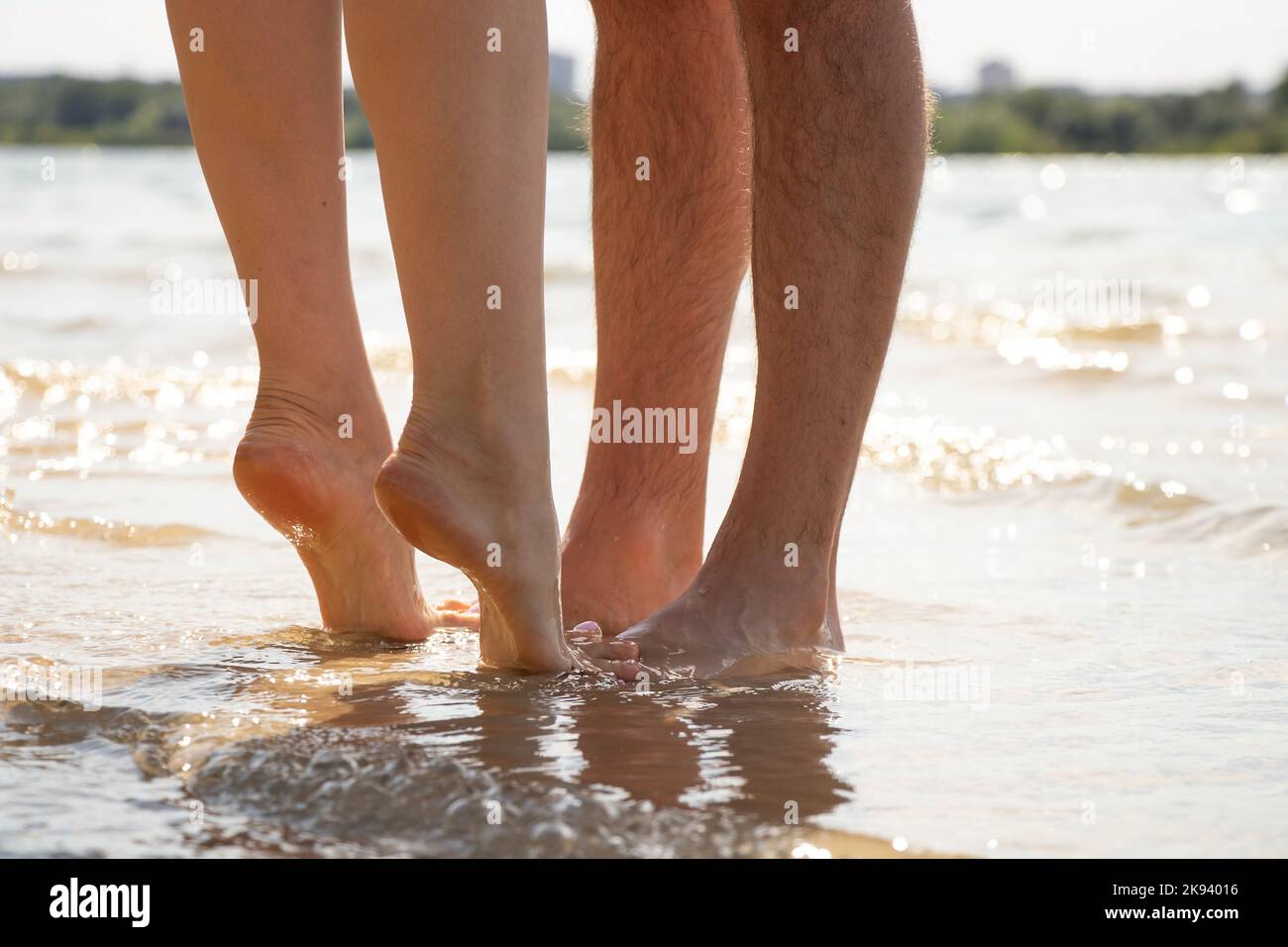 male and female feet in sea water bottom view in the sun Stock Photo ...