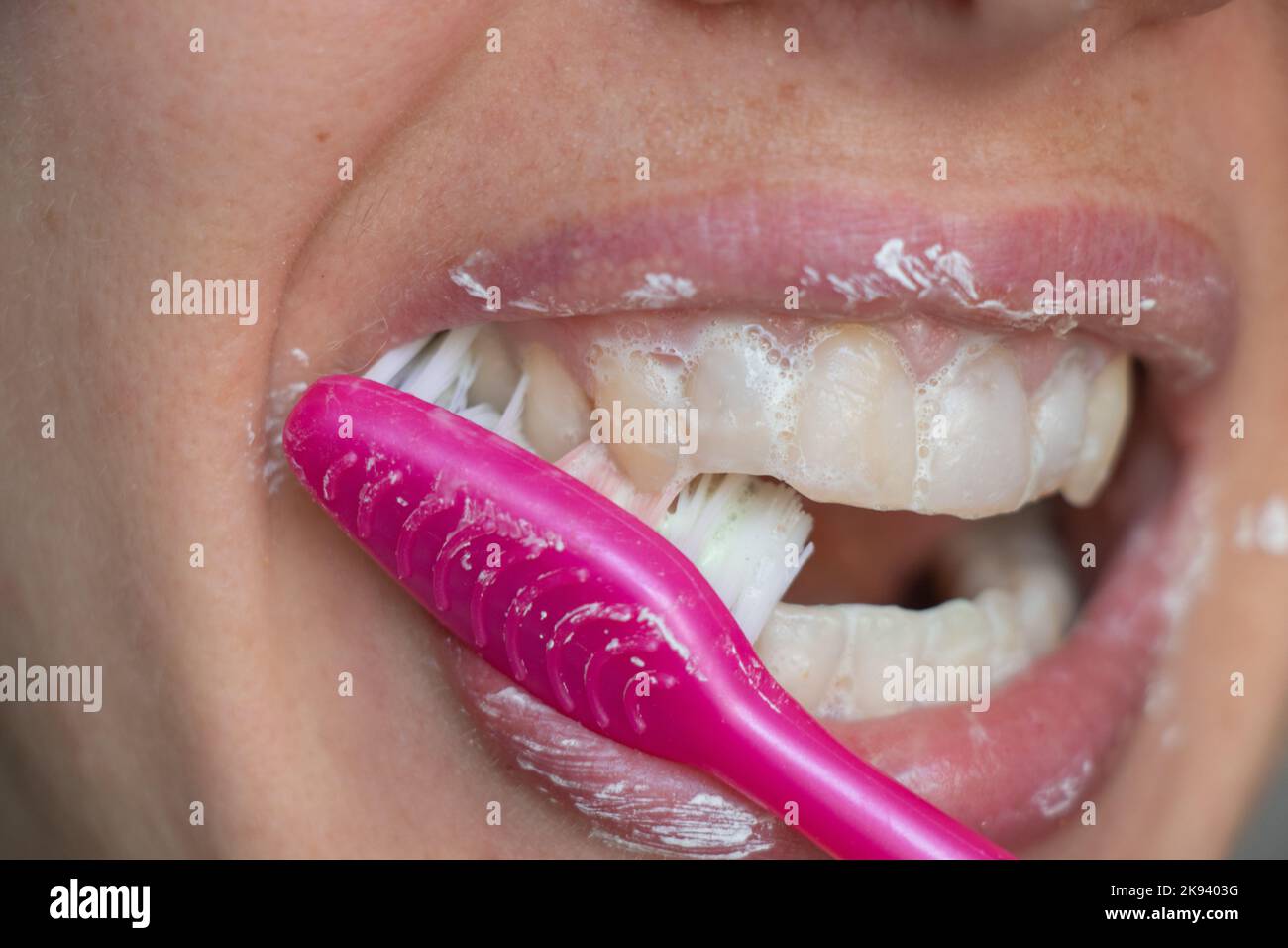 female in toothpaste on an isolated background Stock Photo - Alamy